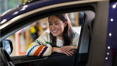 woman looking into toyota car